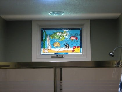 Colorful Stained glass sealife fish window installed in bathroom ...