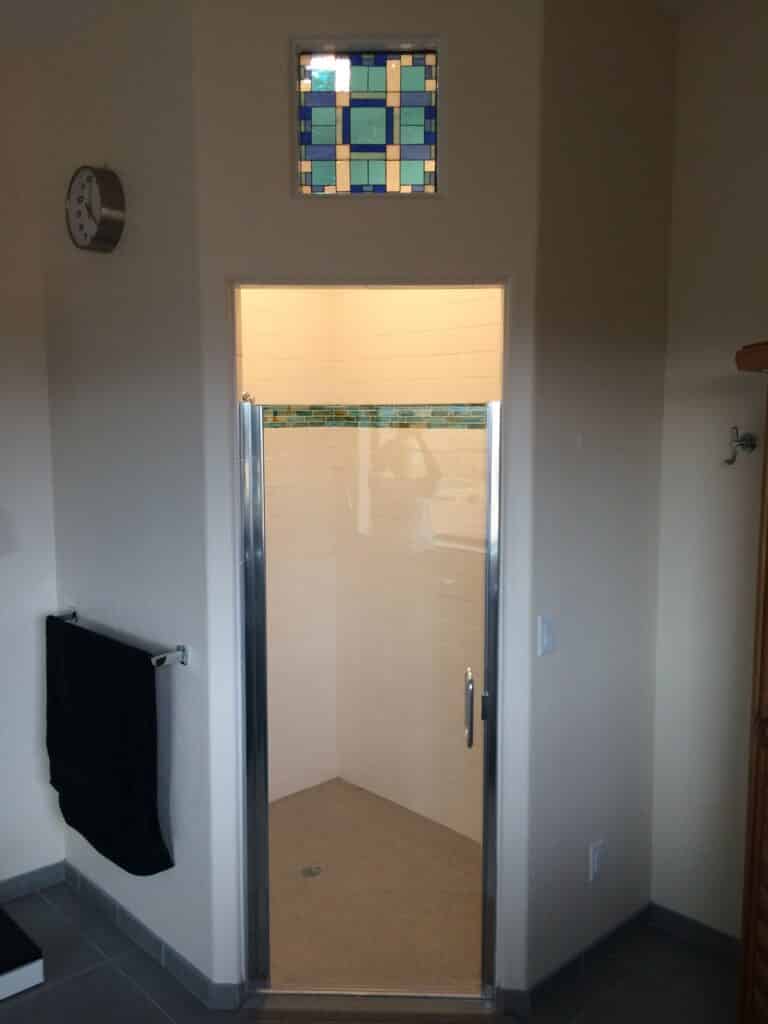 Transom Window Installed In Between A Bathroom And Shower
